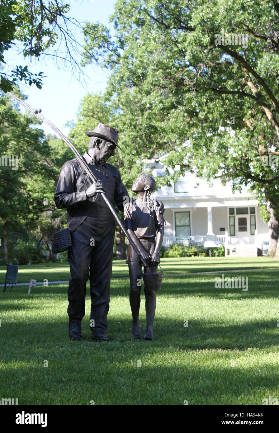 This image depicts multiple generations of people engaged in outdoor ...