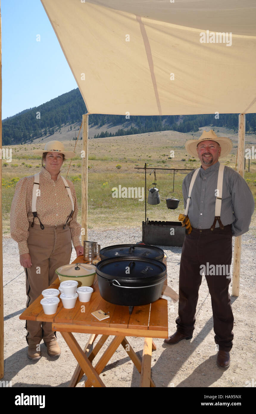 This image shows chefs preparing meals in a national park setting ...