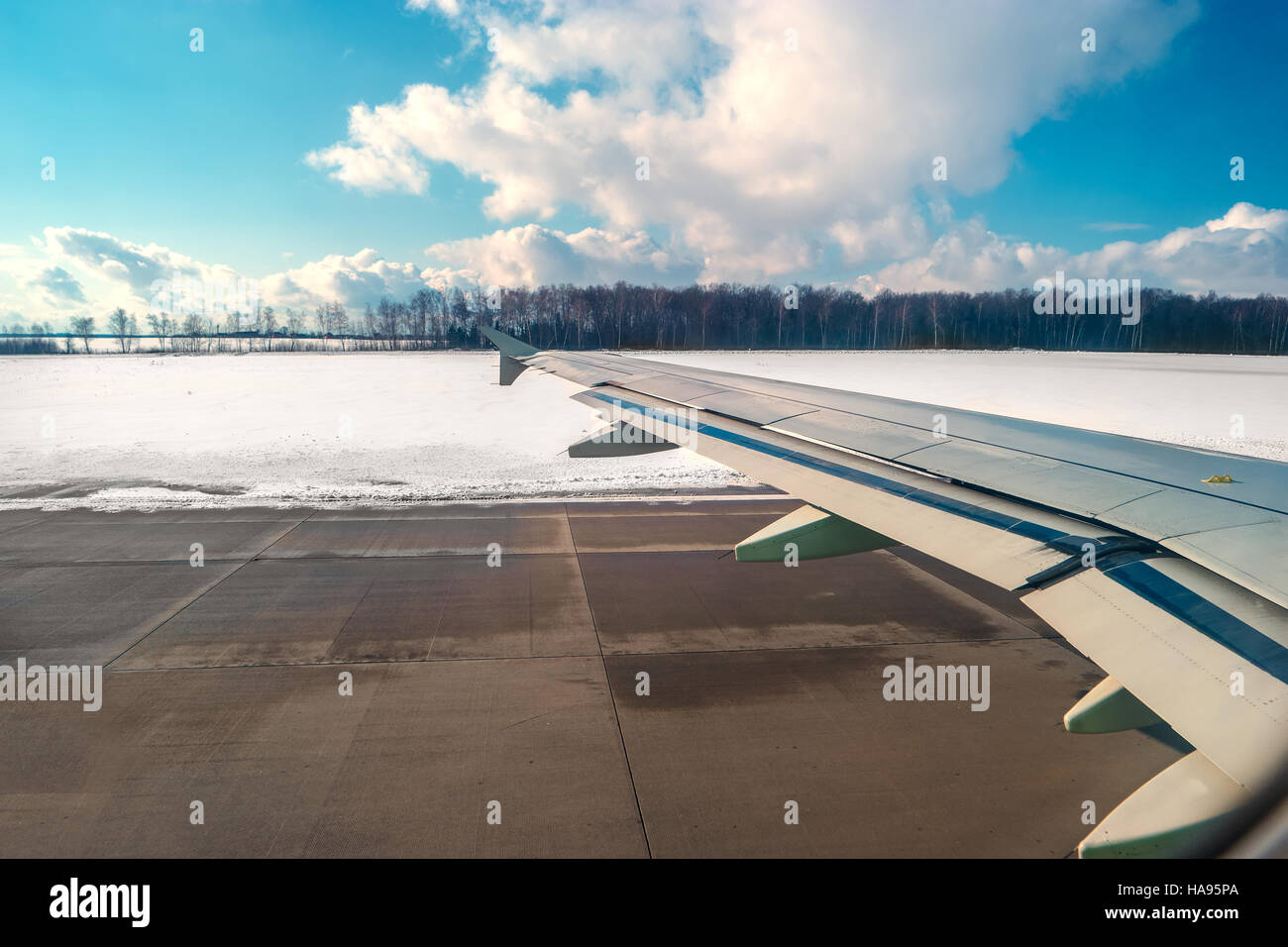Sky and airport lane as seen through window of an aircraft, river and ...