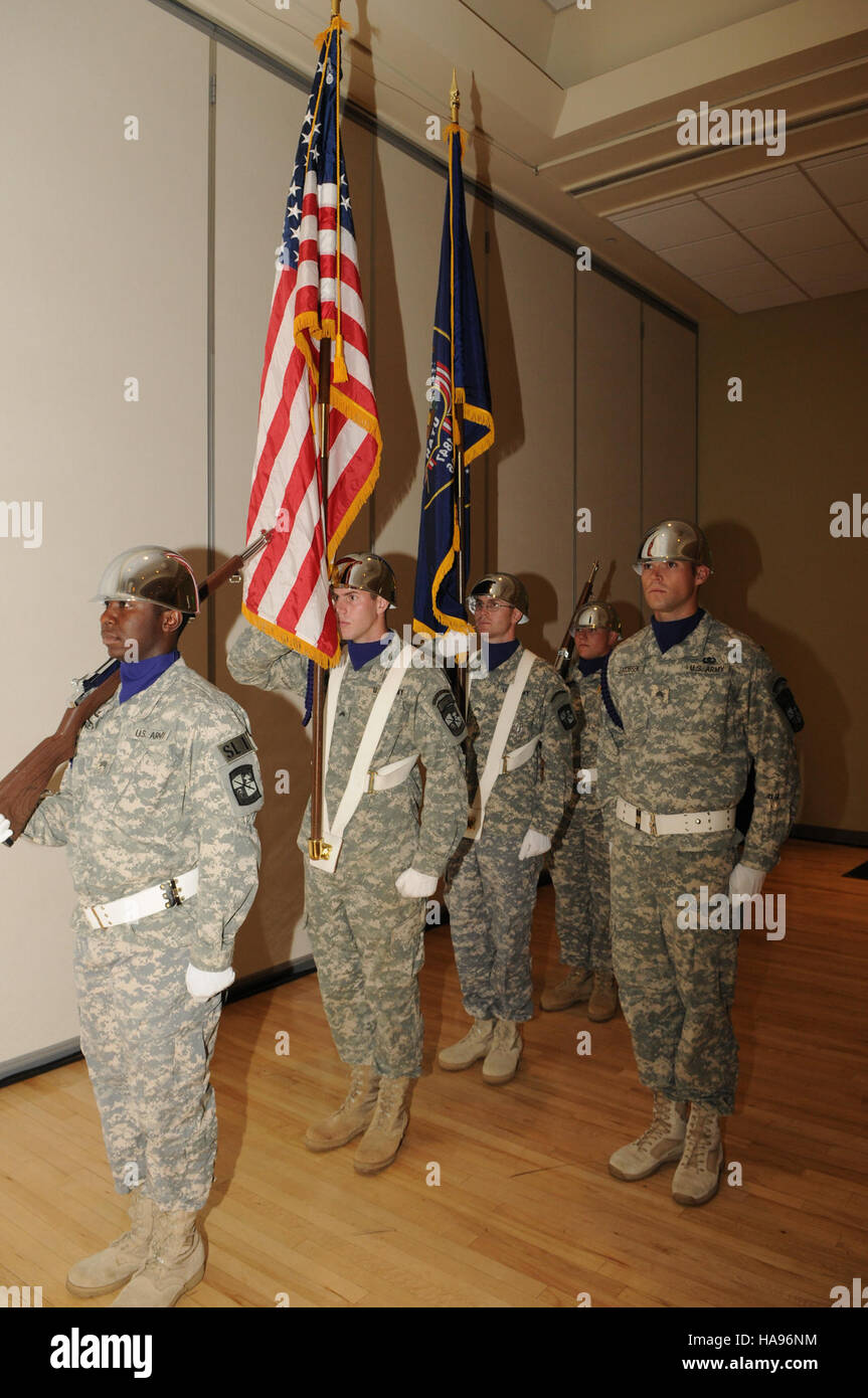 This photograph captures a formal *Presentation of Colors* ceremony, a ...