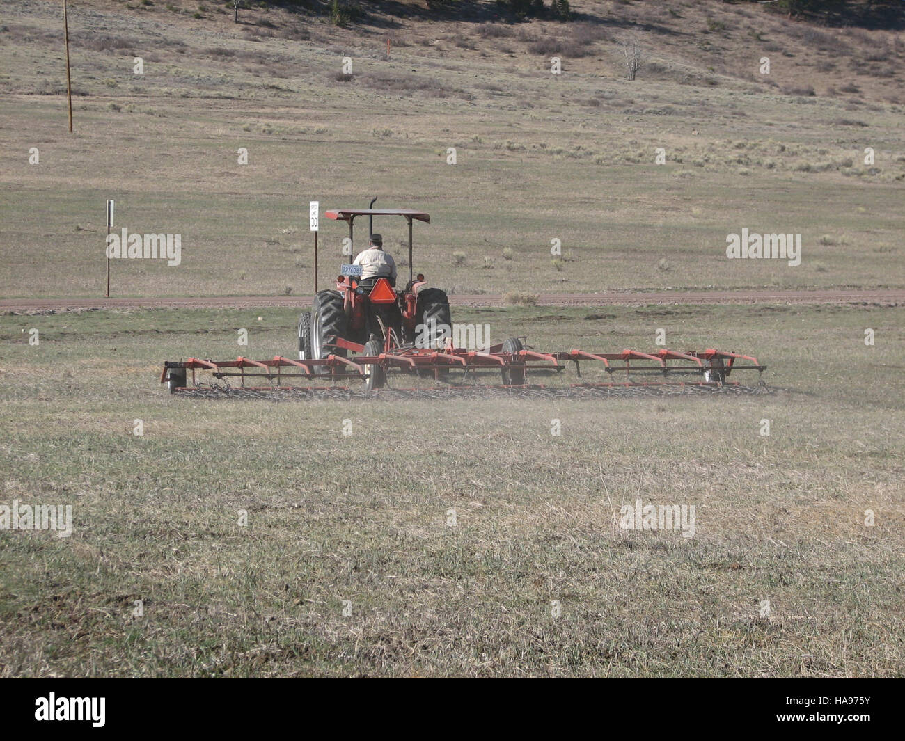 This image shows the spring harrowing process at a prairie wildlife ...