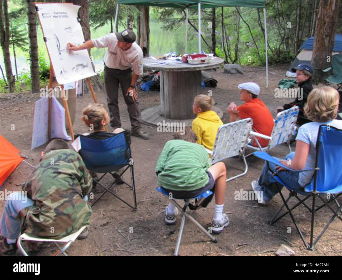 The photograph titled 'Outdoor Classroom' captures students engaged in ...