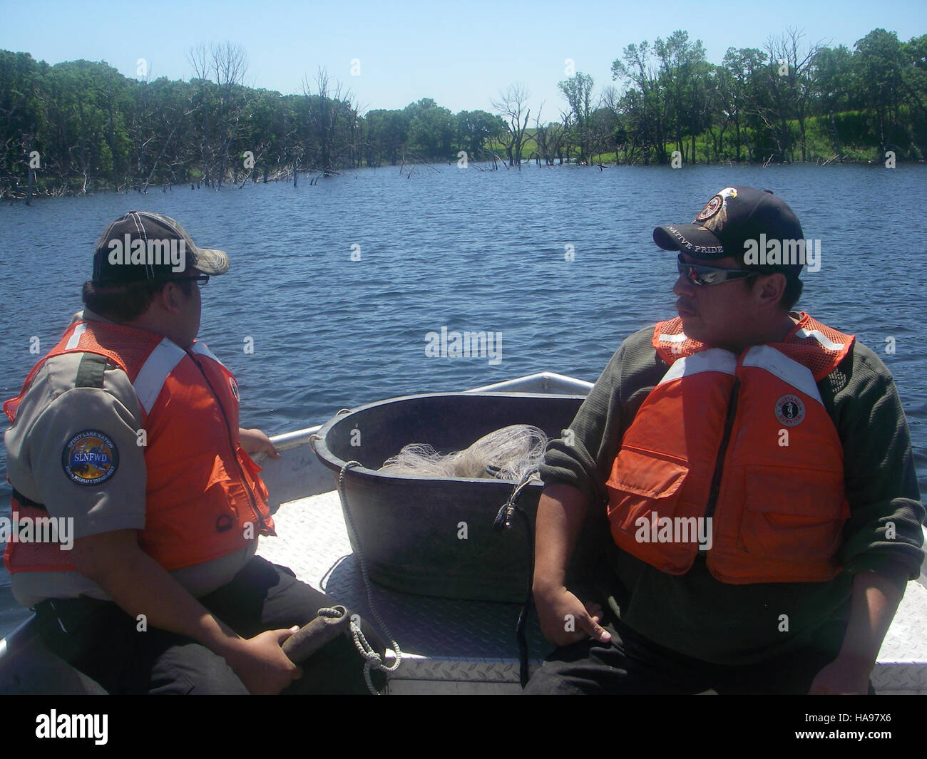 A photograph capturing the process of fish sampling on Spirit Lake ...