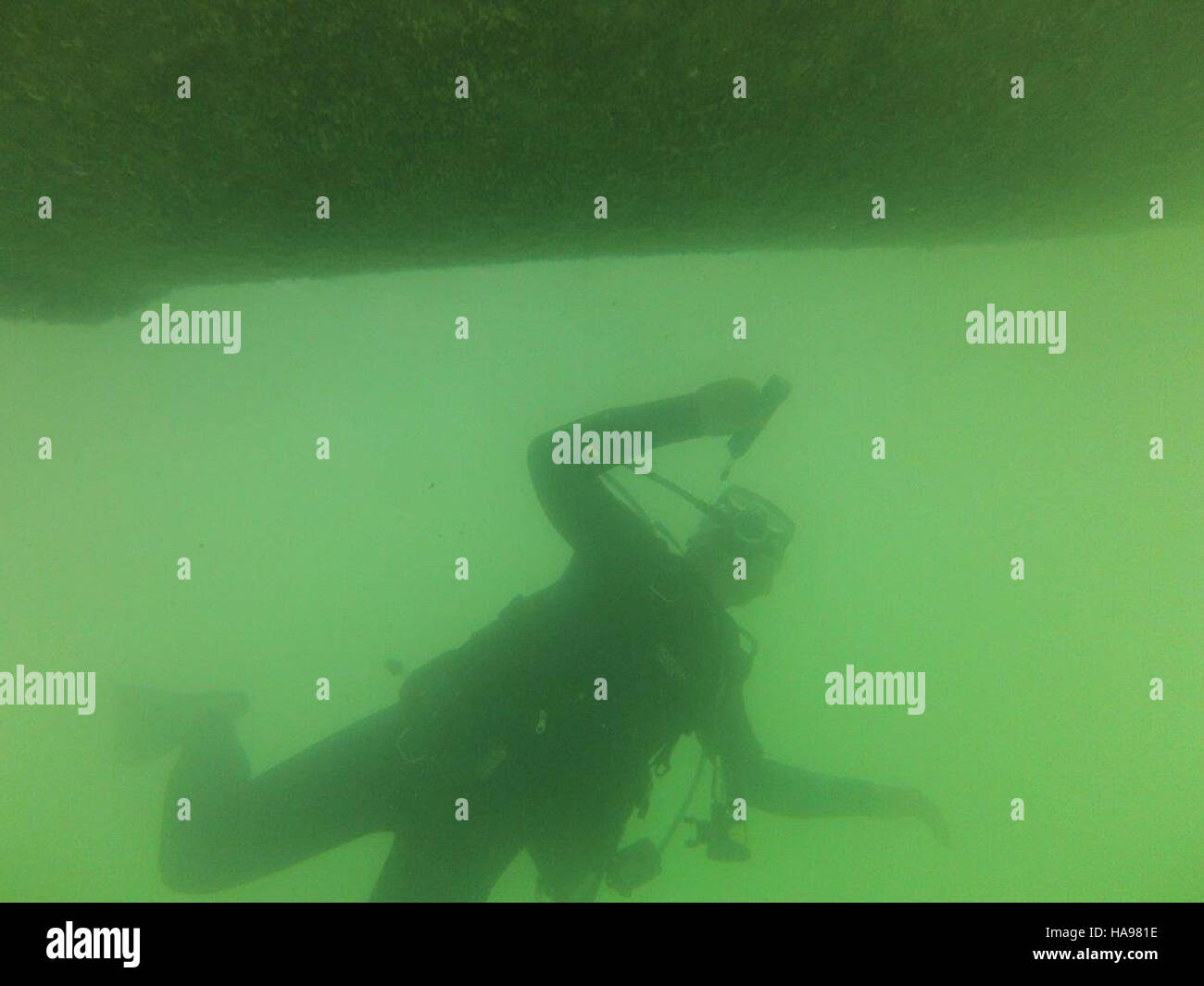 The image shows the R6 Dive Team conducting an underwater search for ...