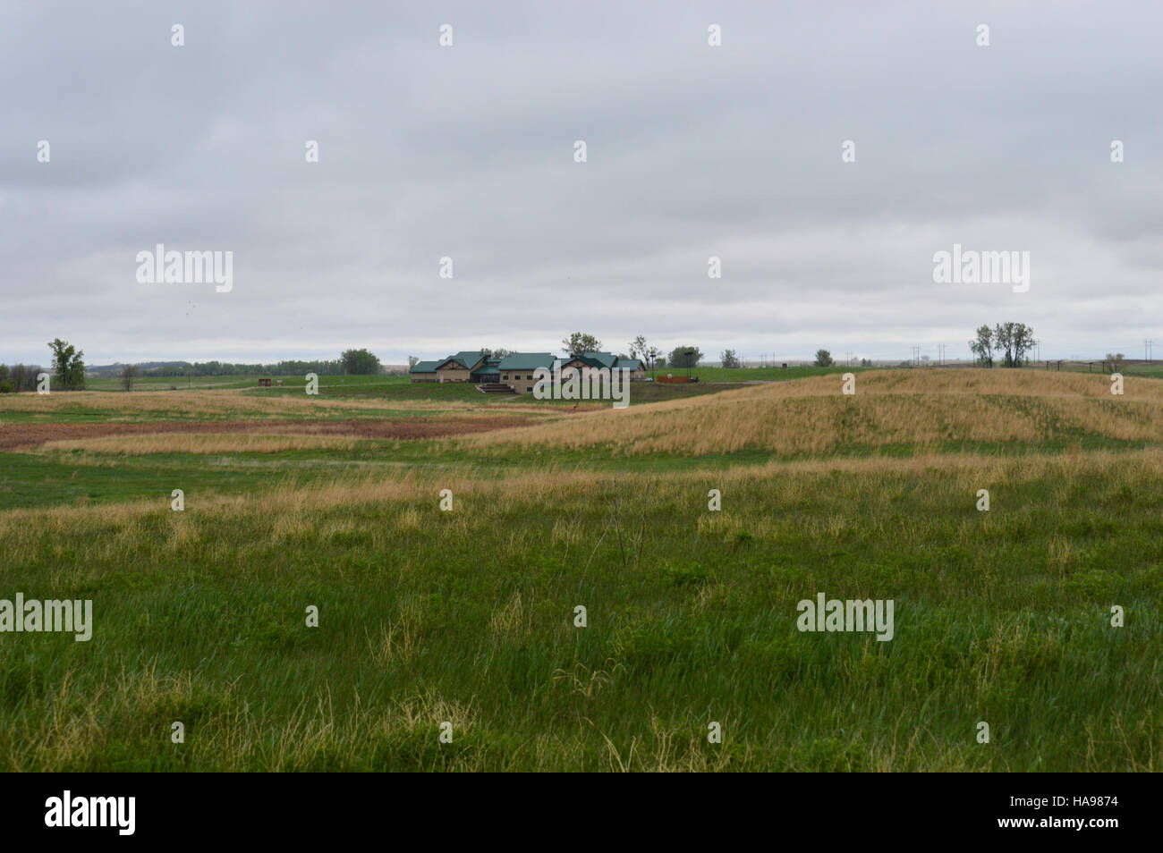 The photograph showcases the expansive landscape of a prairie within a ...