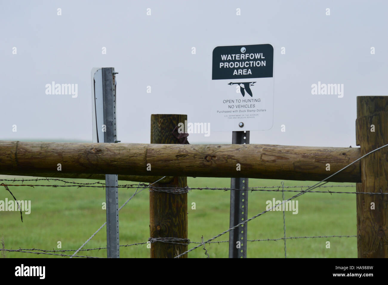A close-up image of a sign for the Waterfowl Production Area in the ...