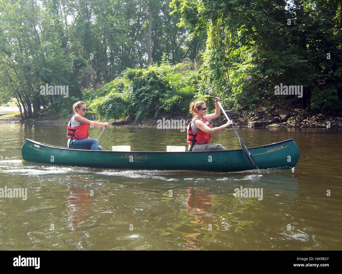 A Youth Conservation Corps (YCC) crew works to remove water chestnut ...
