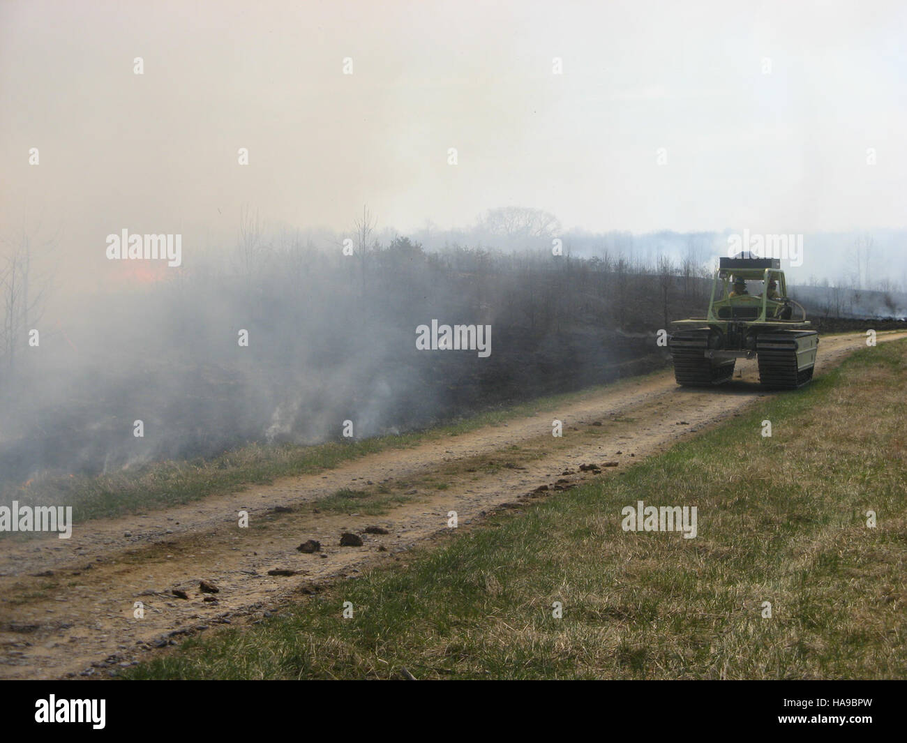 A Marshmaster vehicle operates along a fire line in a national park ...