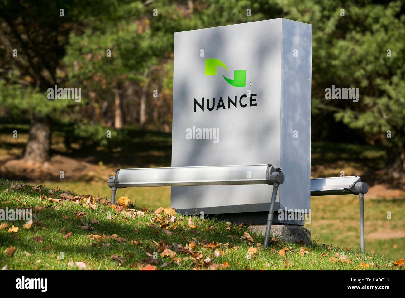 A logo sign outside of a facility occupied by Nuance Communications in ...