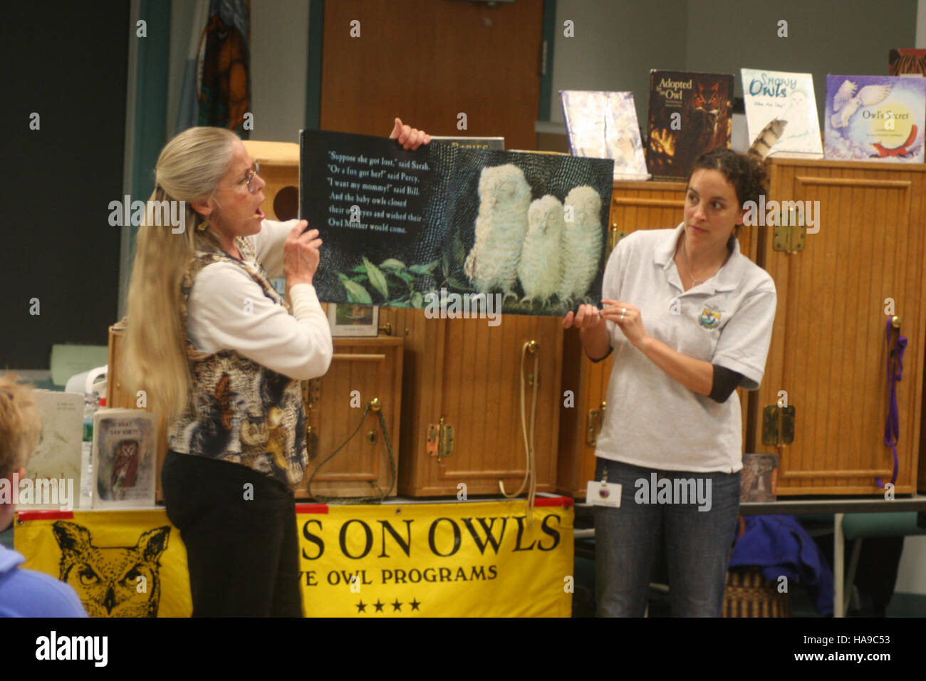 The U.S. Fish and Wildlife Service showcases a poster of snowy owls, a ...