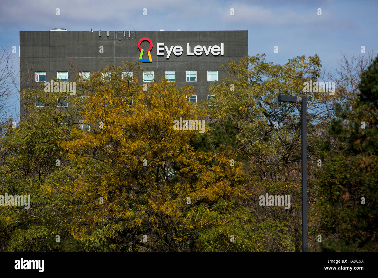 A logo sign outside of a facility occupied by Eye Level Learning in ...