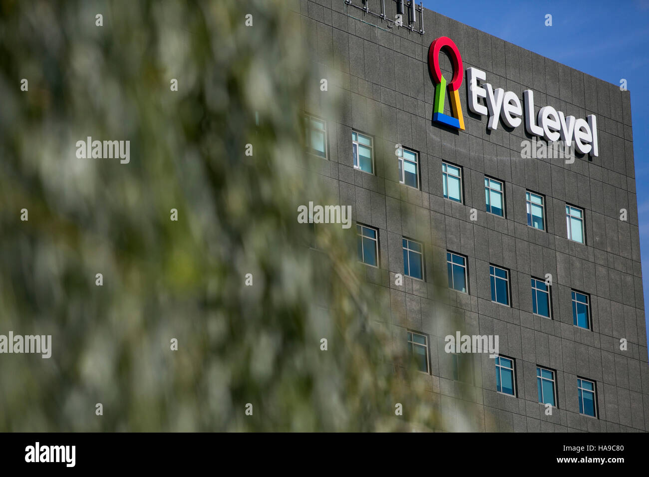 A logo sign outside of a facility occupied by Eye Level Learning in ...