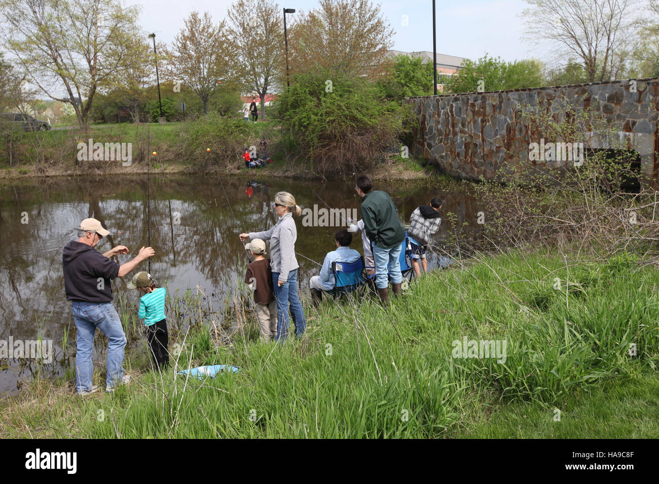 Families participate in fishing activities at a U.S. National Park ...