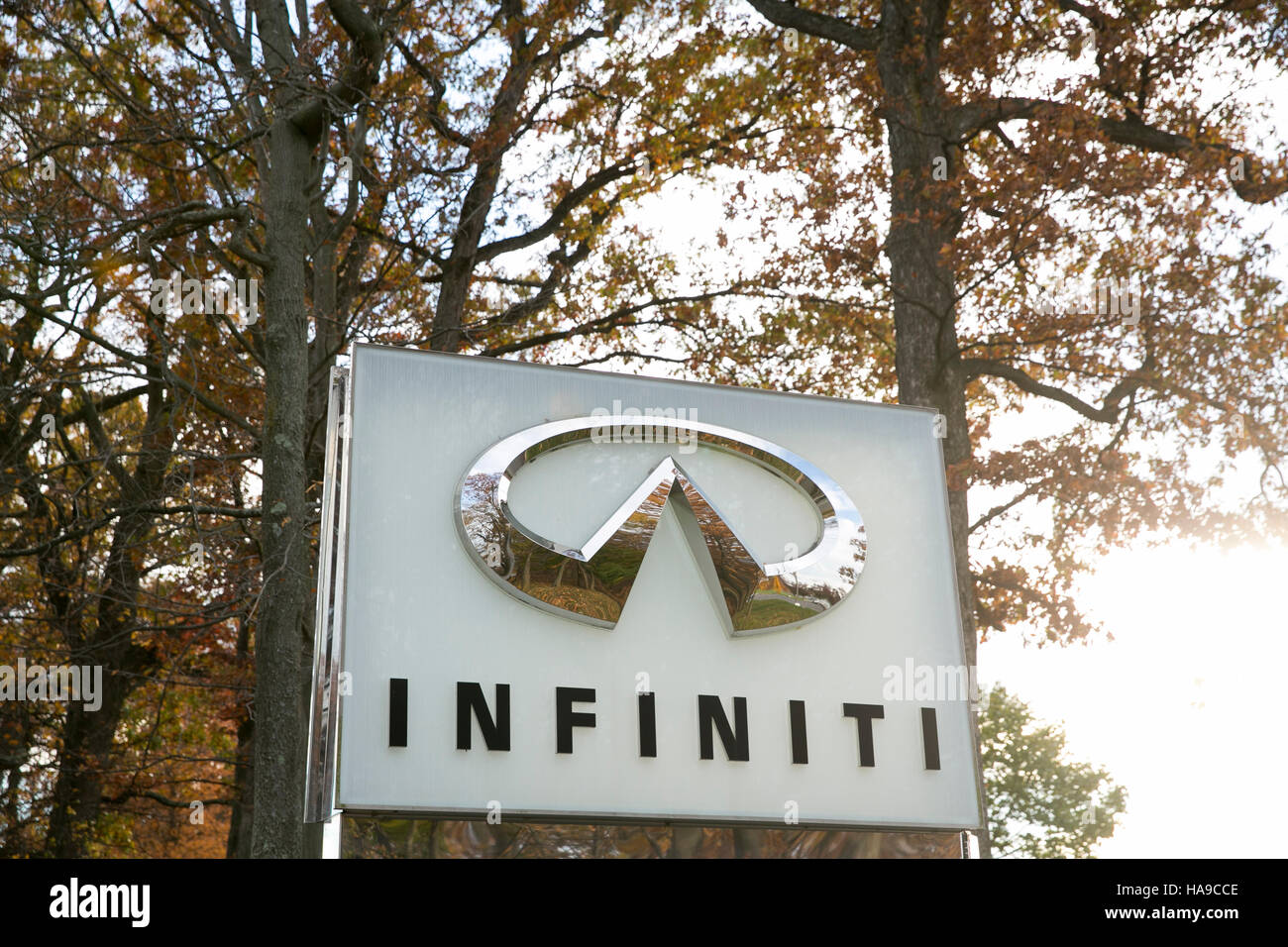 A logo sign outside of a facility occupied by the car maker Infiniti ...