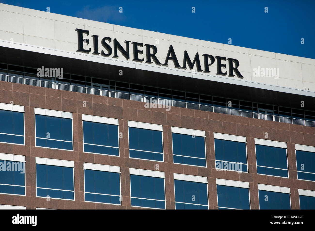 A logo sign outside of a facility occupied by EisnerAmper in Edison ...