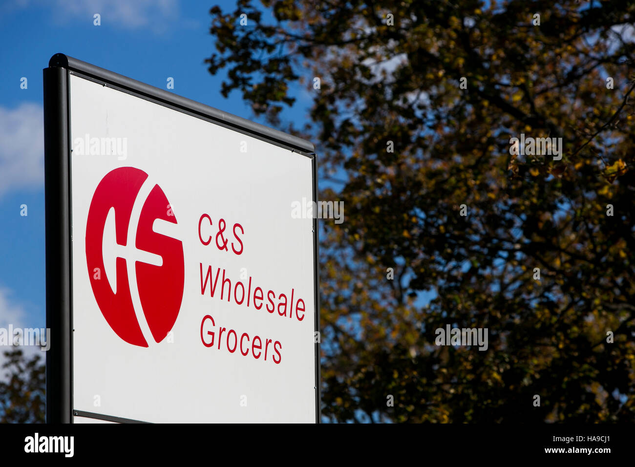 A logo sign outside of a facility occupied by C&S Wholesale Grocers in ...