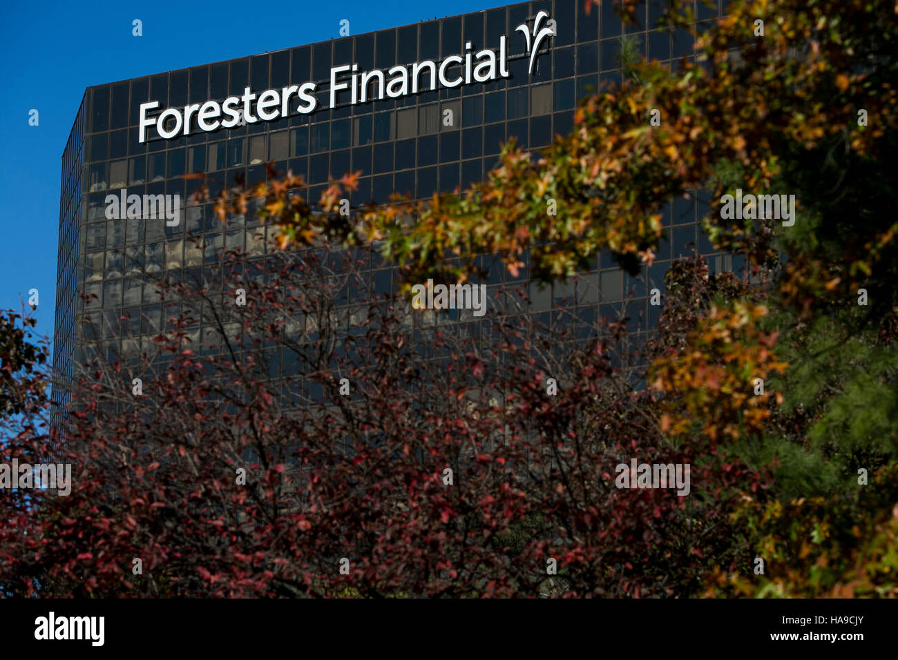 A logo sign outside of a facility occupied by Foresters Financial in ...