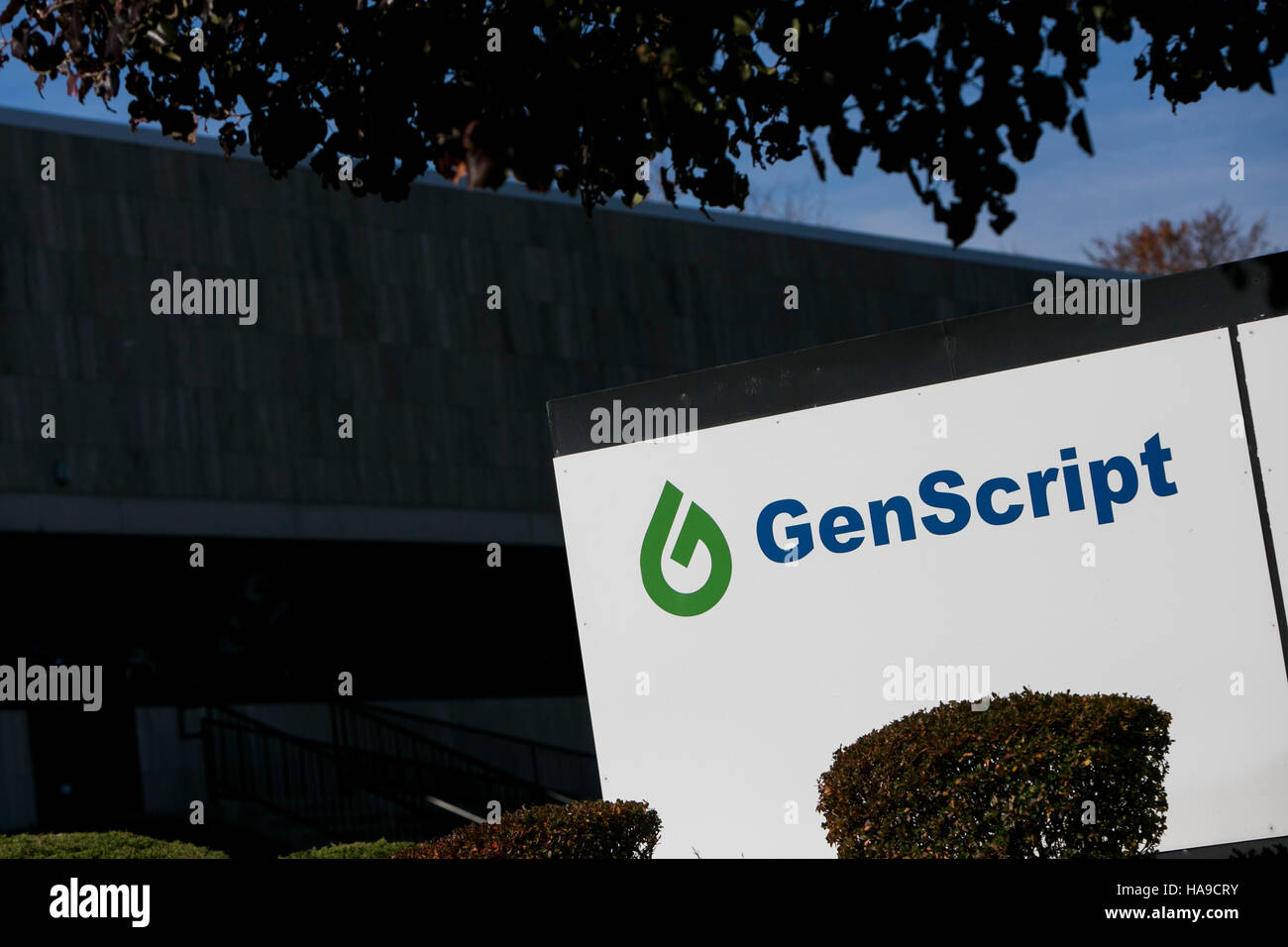 A logo sign outside of a facility occupied by GenScript in Piscataway ...
