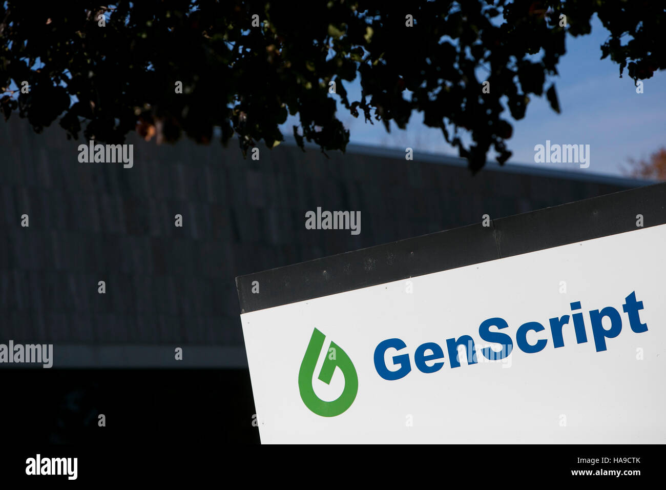 A logo sign outside of a facility occupied by GenScript in Piscataway ...