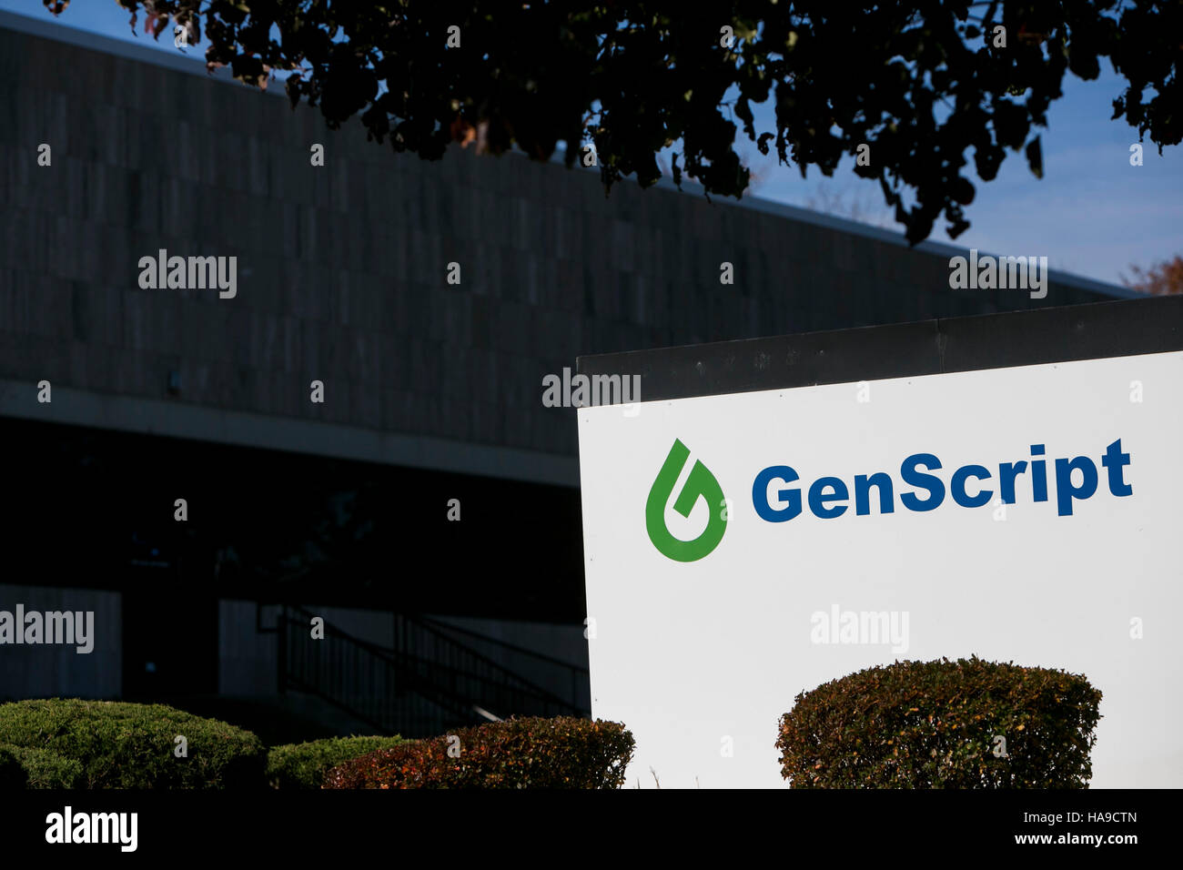 A logo sign outside of a facility occupied by GenScript in Piscataway ...