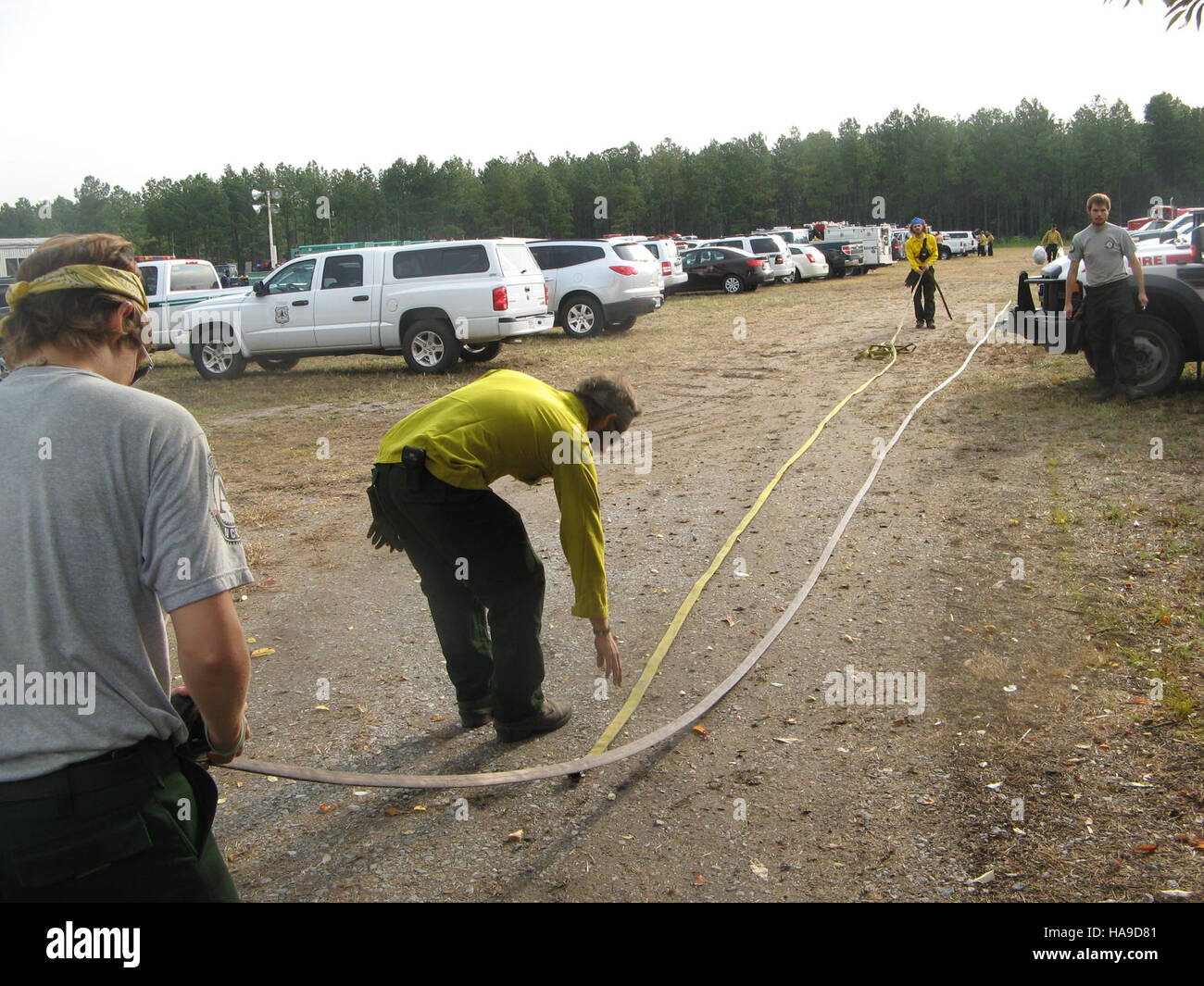 AmeriCorps NCCC team members assist in a conservation effort, rolling ...