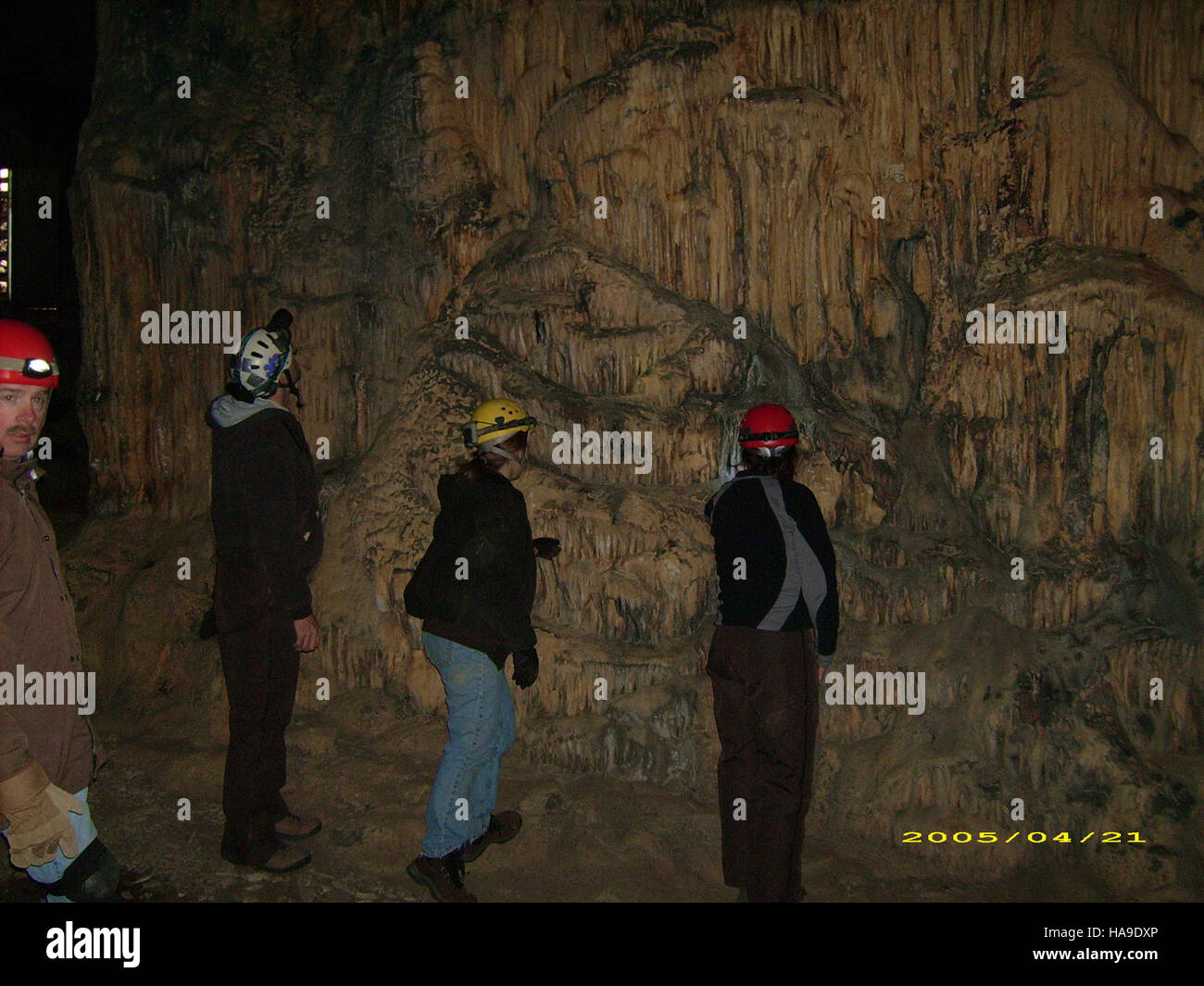 A biologist examines the unique rock formations inside Madison ...
