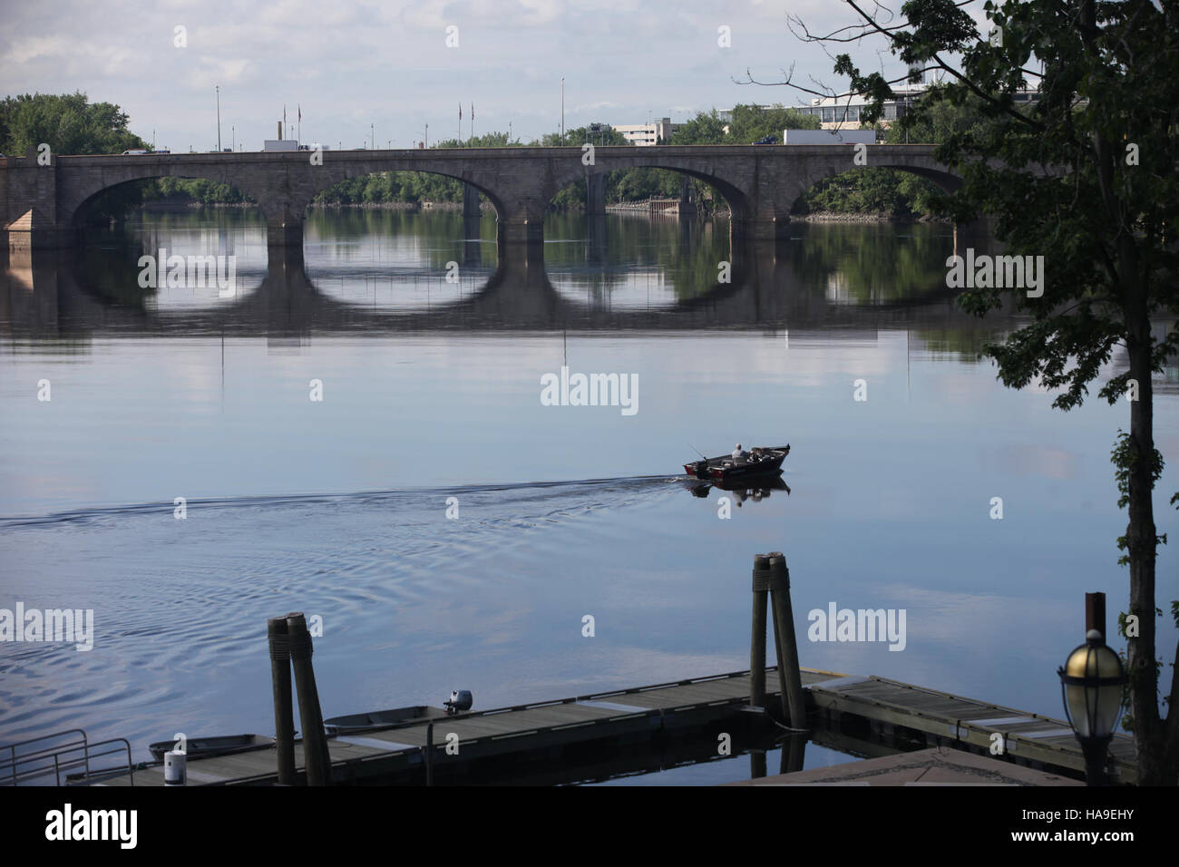 A peaceful river view with a boater in a national park. This image ...