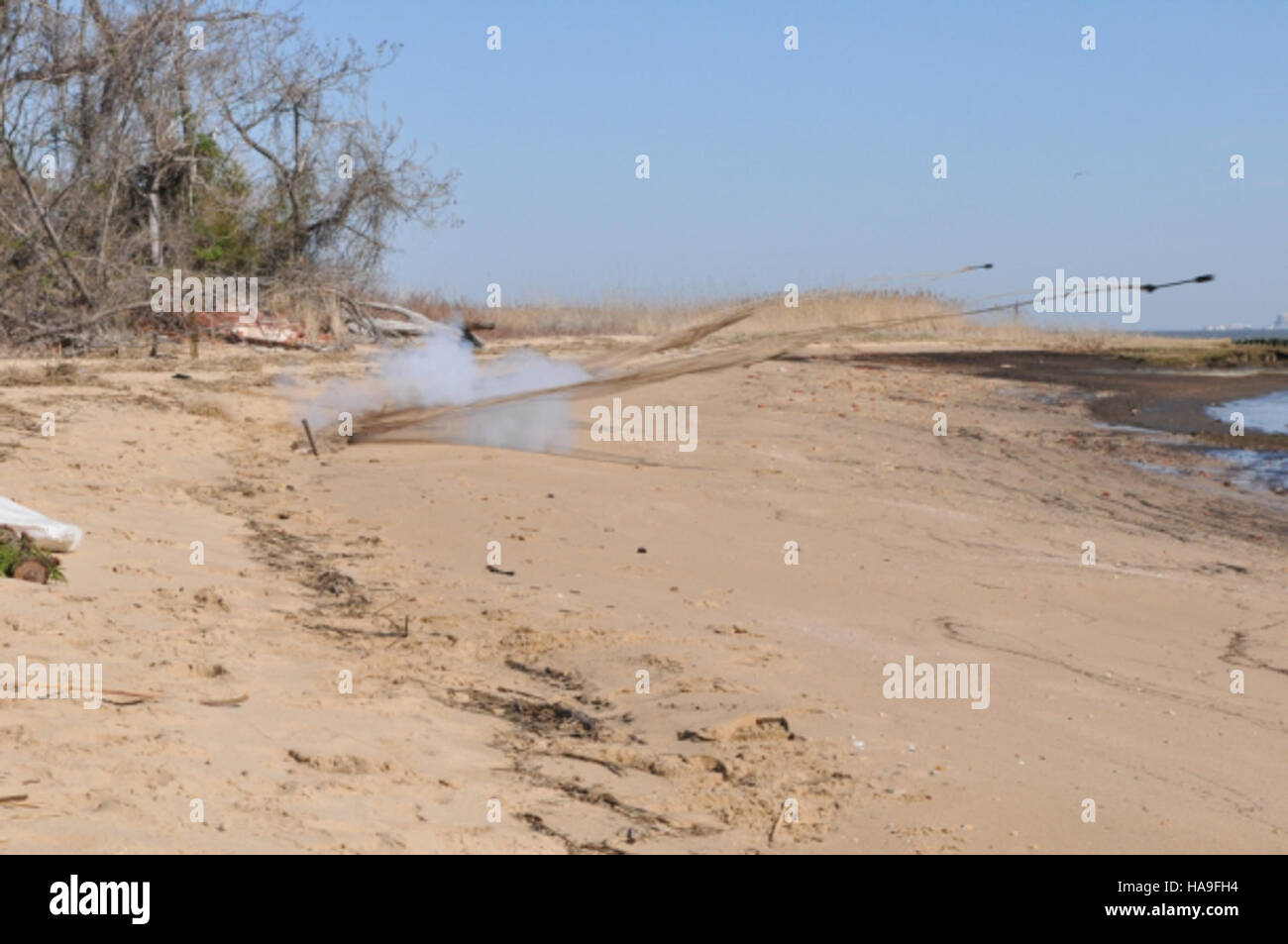 This image shows a cannon net being used for wildlife capture and ...
