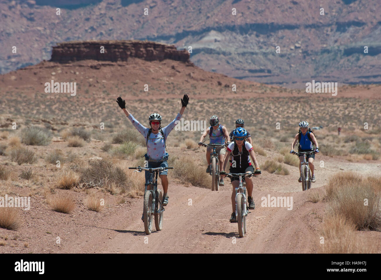 Riders travel along the White Rim Road in Canyonlands National Park, a ...