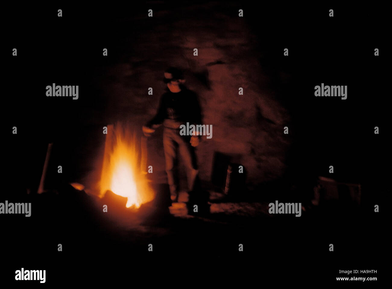 A historic photo from 1959 showing Bates Wilson tending a fire at ...