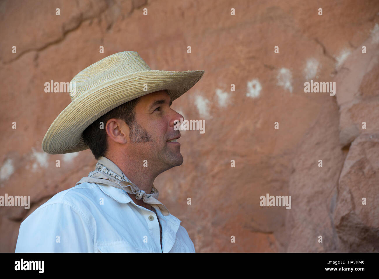 Visitors at Canyonlands National Park appreciate the ancient rock art ...