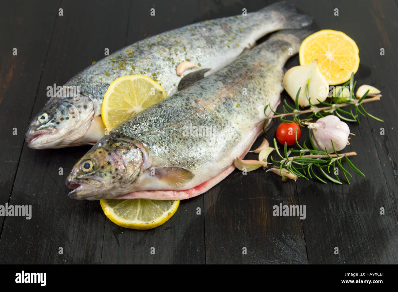 raw seasoned trout on a wooden table Stock Photo - Alamy