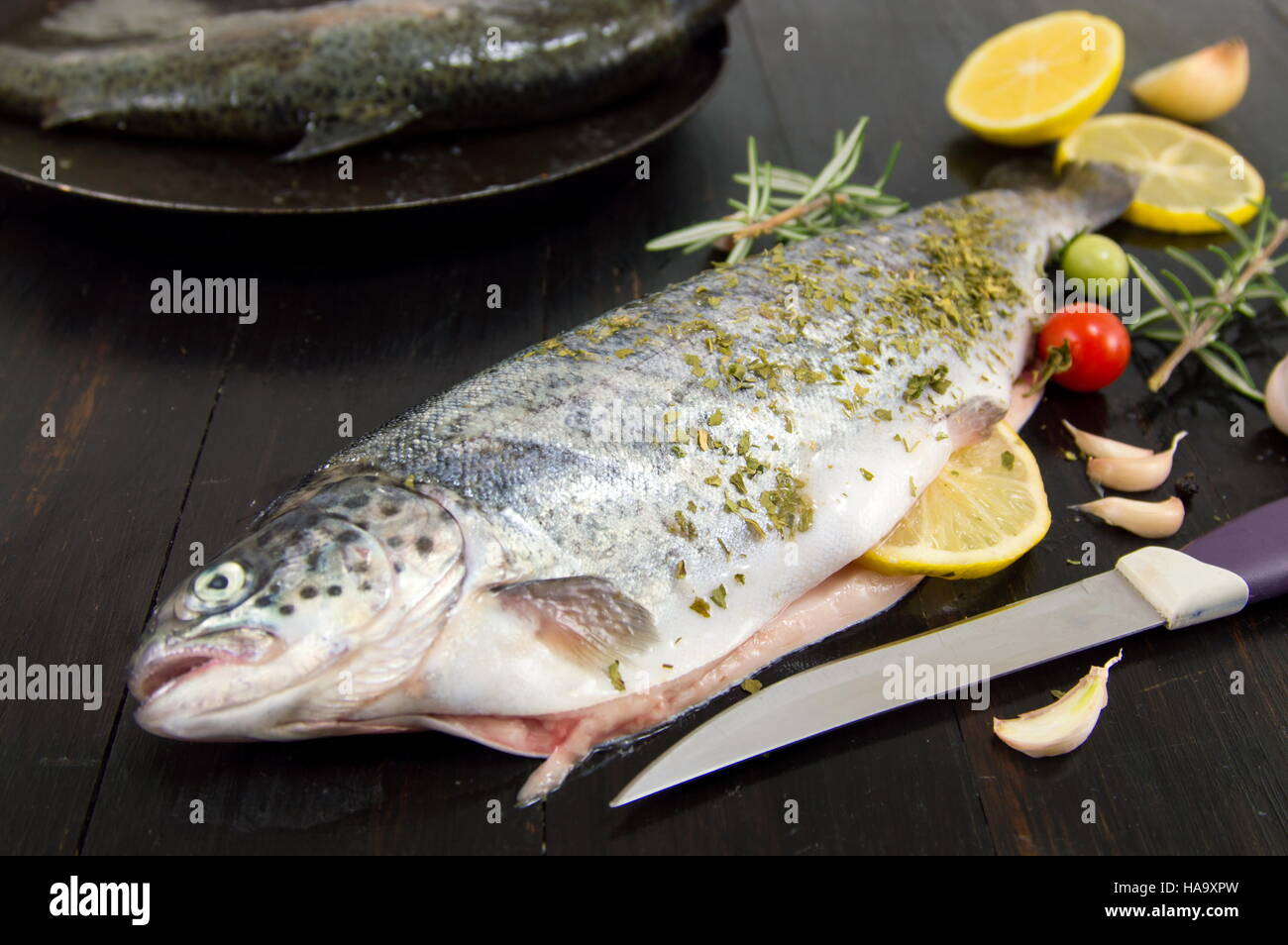 raw seasoned trout on a wooden table Stock Photo - Alamy