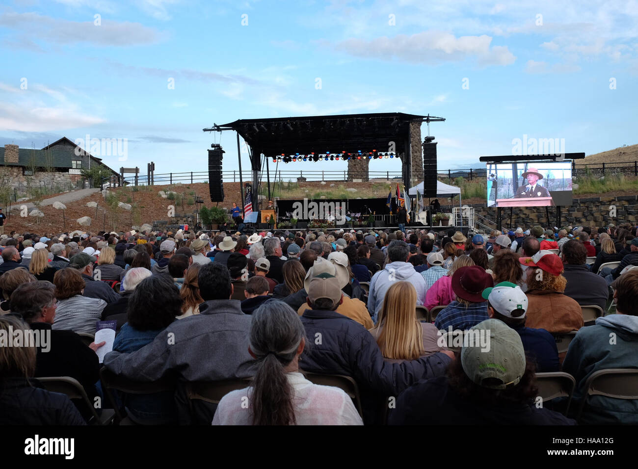 The audience listens as Director Jarvis addresses the crowd at a ...