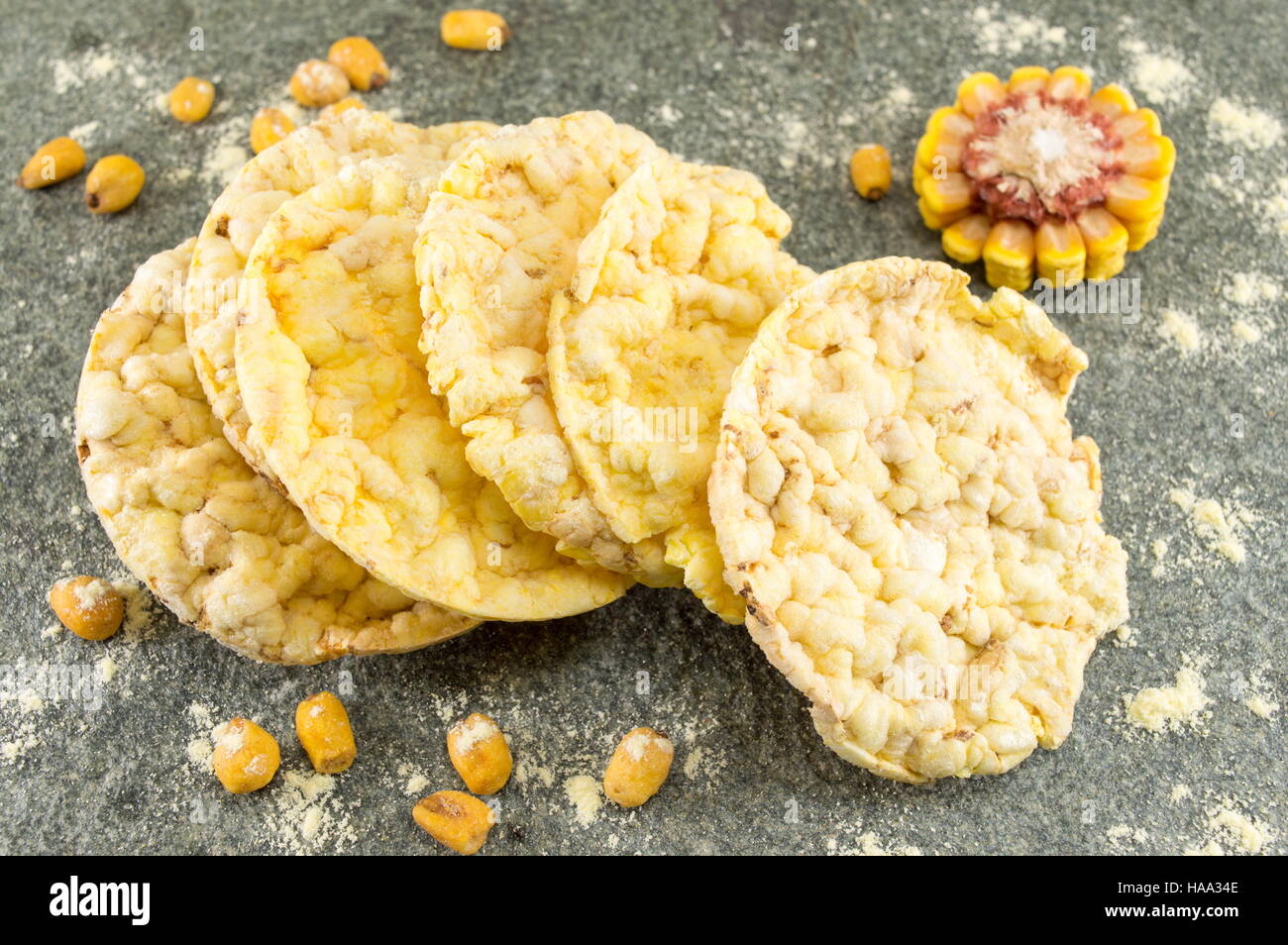 circle shaped corn snacks and corn kernels Stock Photo - Alamy