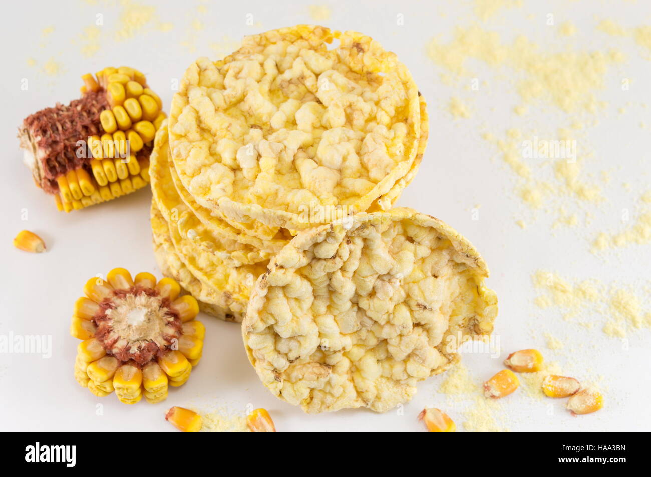 circle shaped corn snacks and corn kernels Stock Photo - Alamy