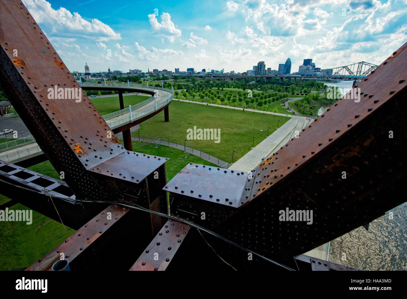 A park ranger on a bridge in a national park demonstrates the ...