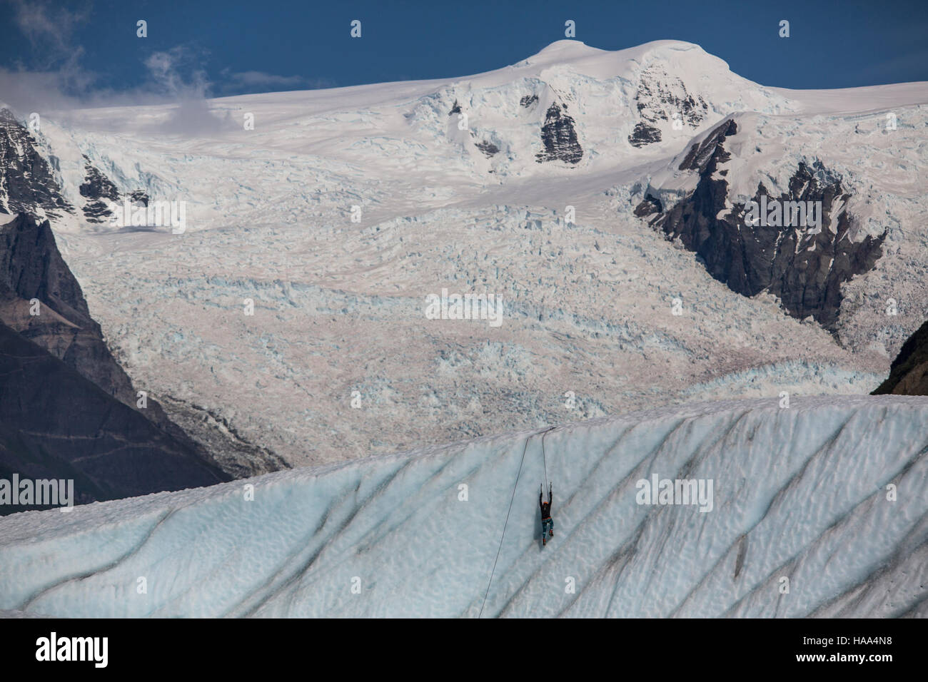 Ice climbers scale the Root Glacier in Alaska, showcasing an adventure ...
