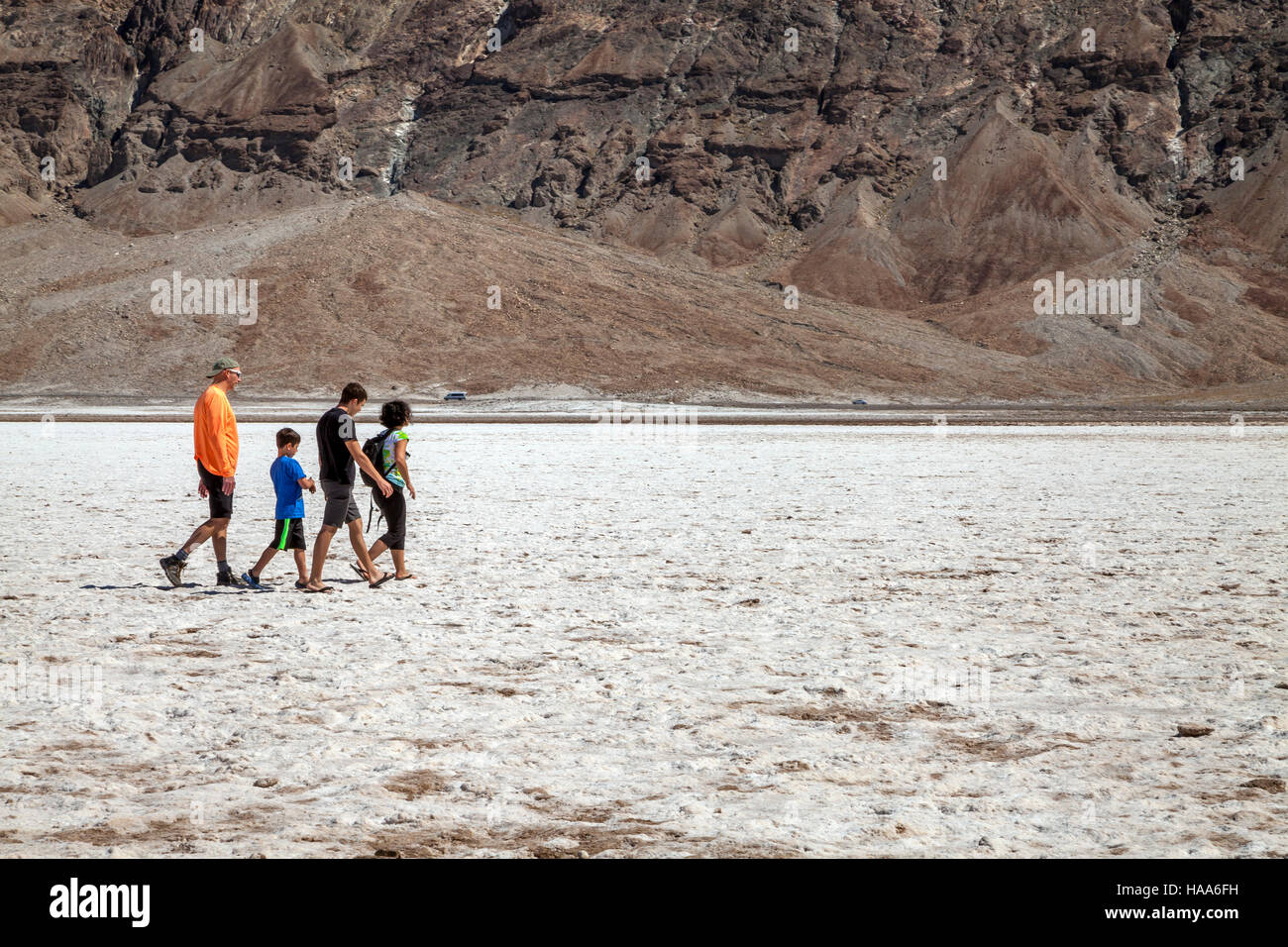 Family walking in the salt basin, Badwater Basin, Death Valley National ...