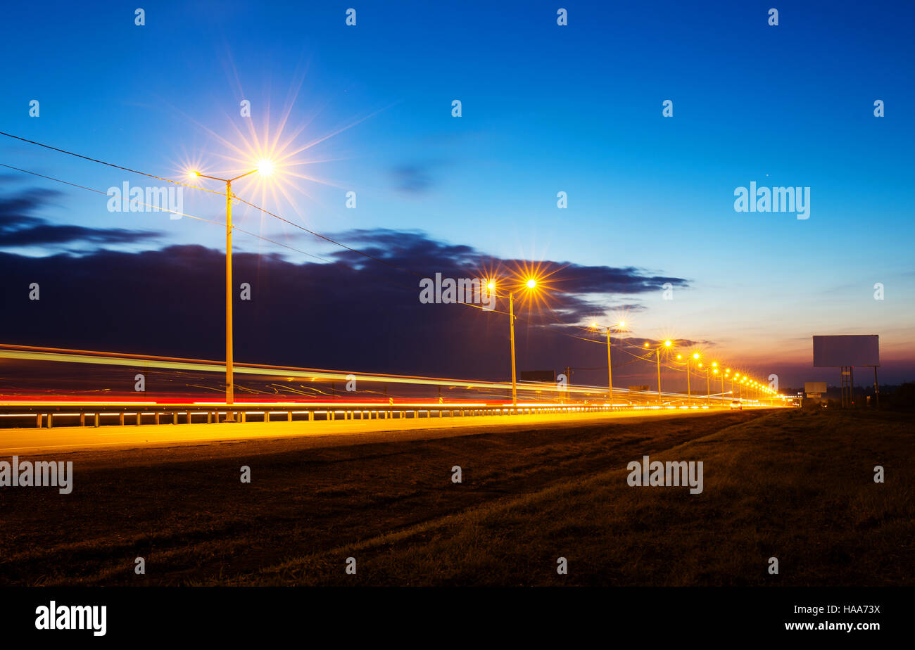 Sunset over highway, long exposure photo Stock Photo - Alamy