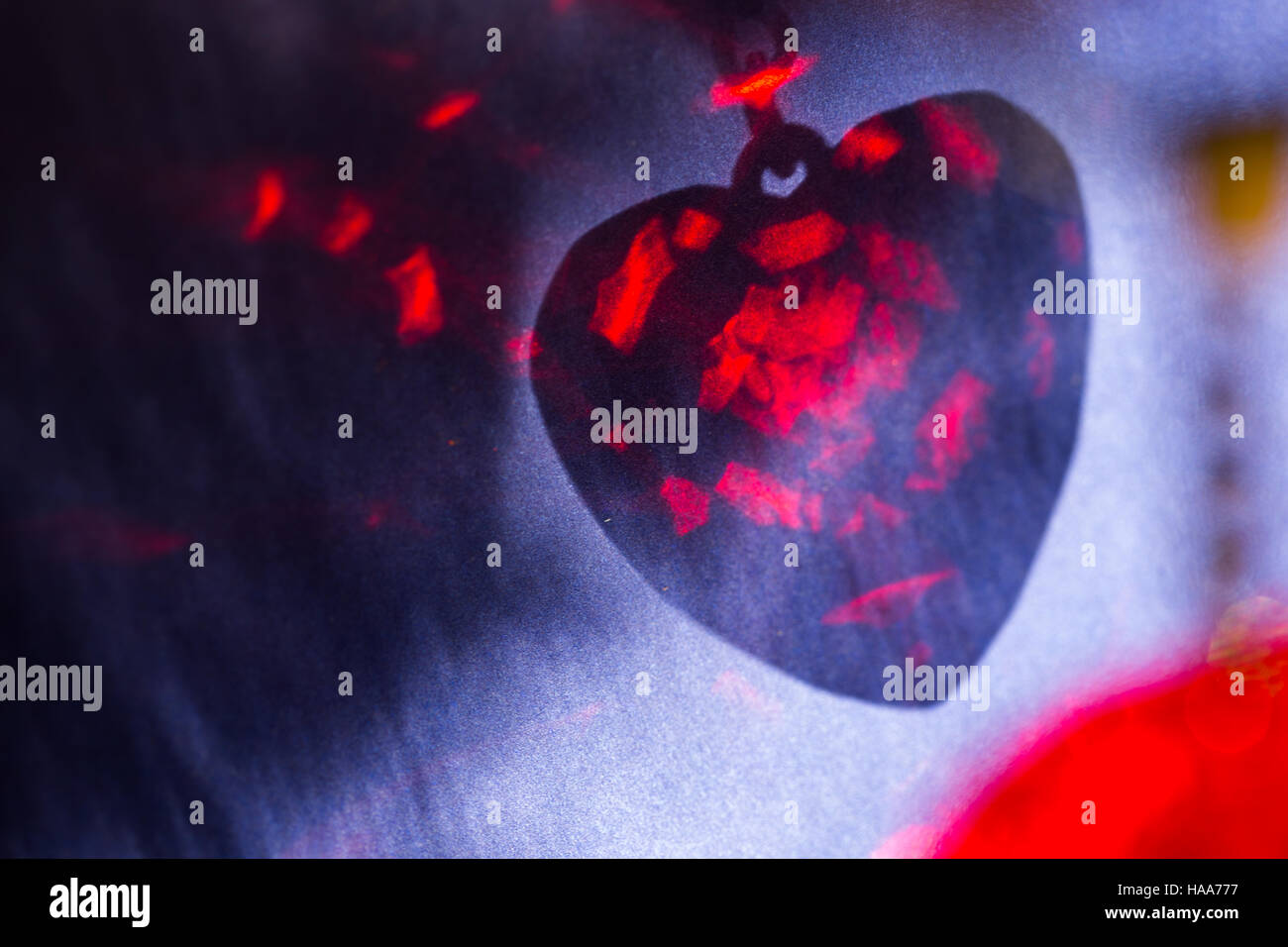 Red heart shape shadow on blue surface, abstract holiday background ...