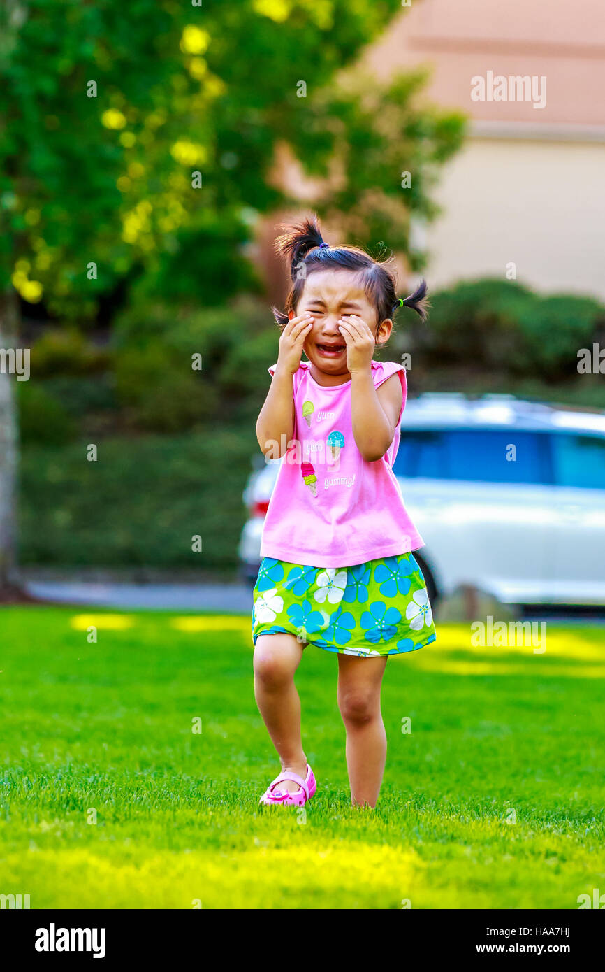 Adorable girl upset and cry in the park Stock Photo - Alamy