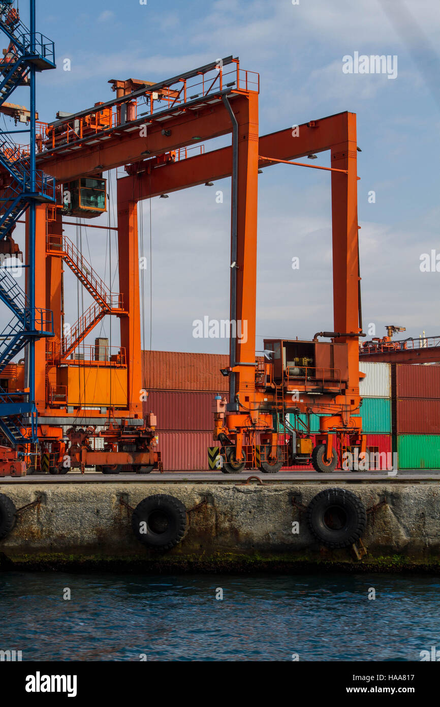 Seaport crane and containers with blue sky Stock Photo - Alamy