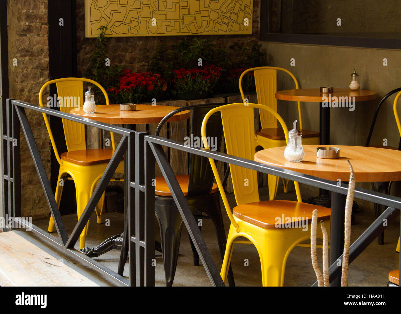 The street cafe with yellow chairs Stock Photo - Alamy