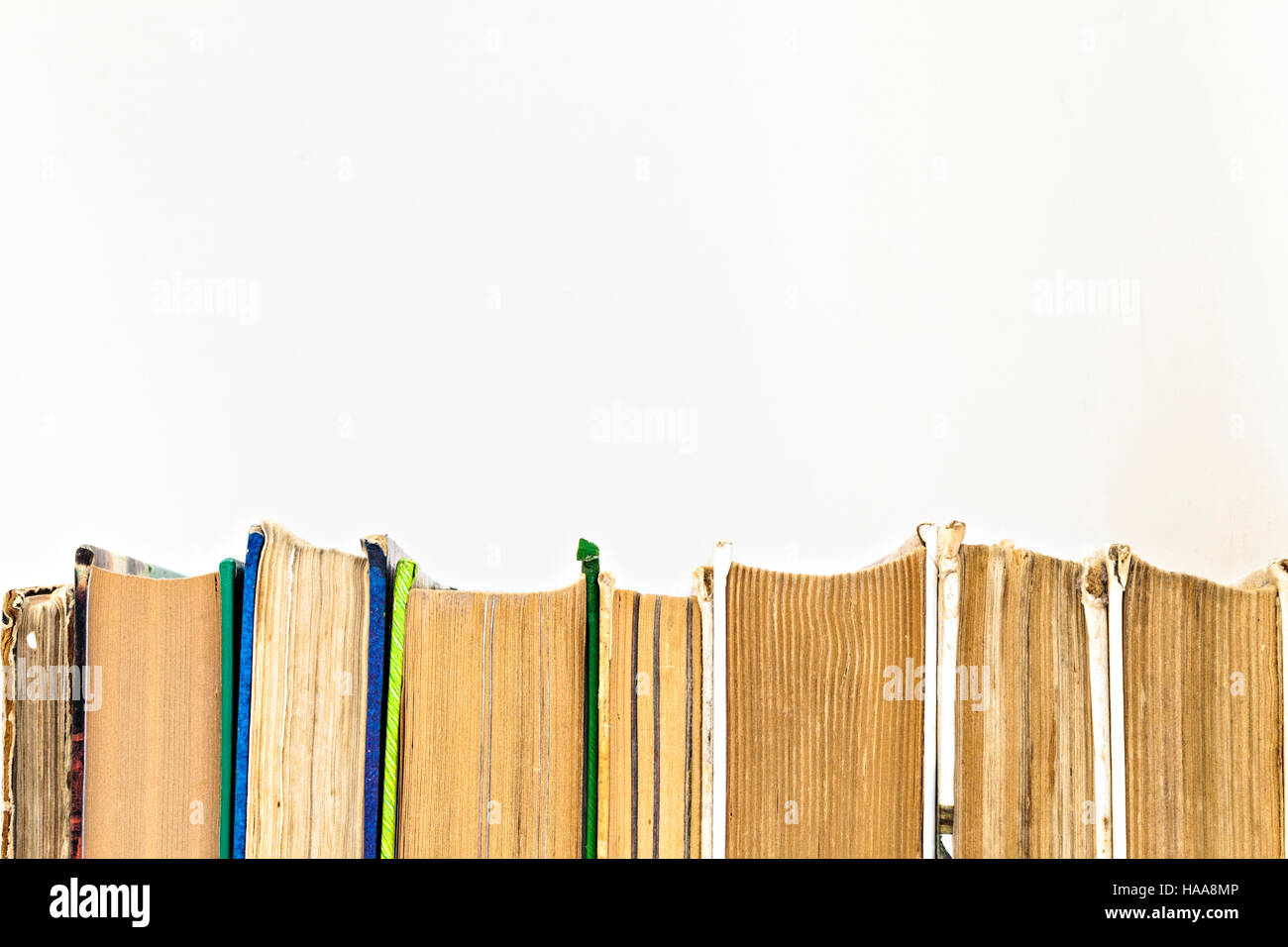 many books standing in a row isolated Stock Photo - Alamy