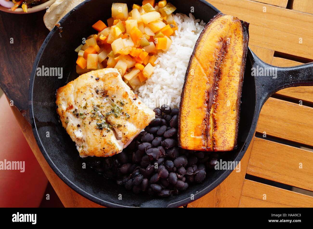 Traditional Costa Rican Casado meal with rice, beans, plantains and ...