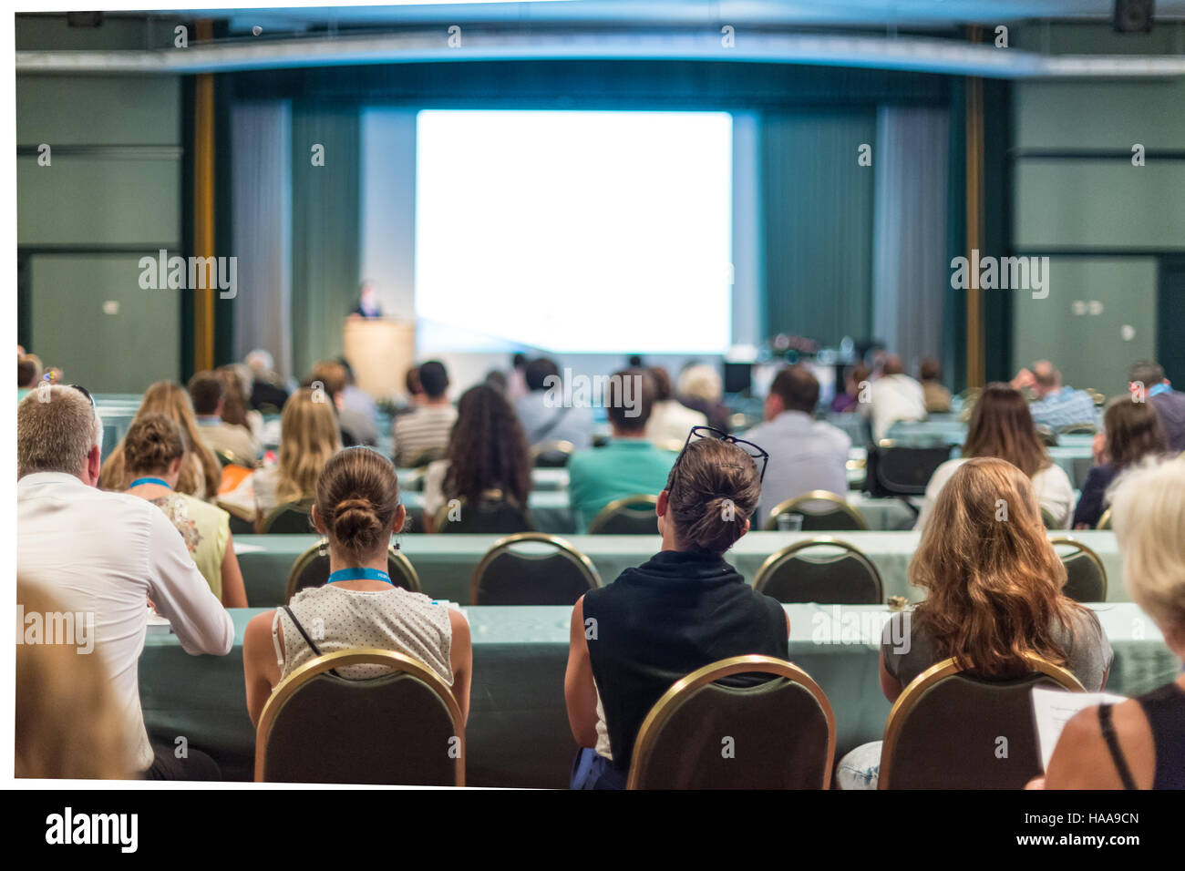 Audience in lecture hall participating at business conference Stock ...