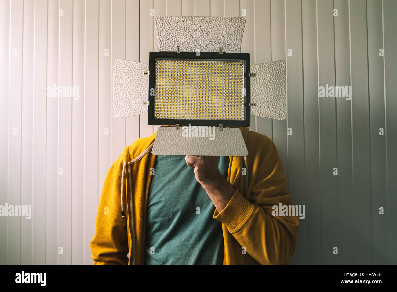 Man posing with led lighting equipment covering his face Stock Photo ...