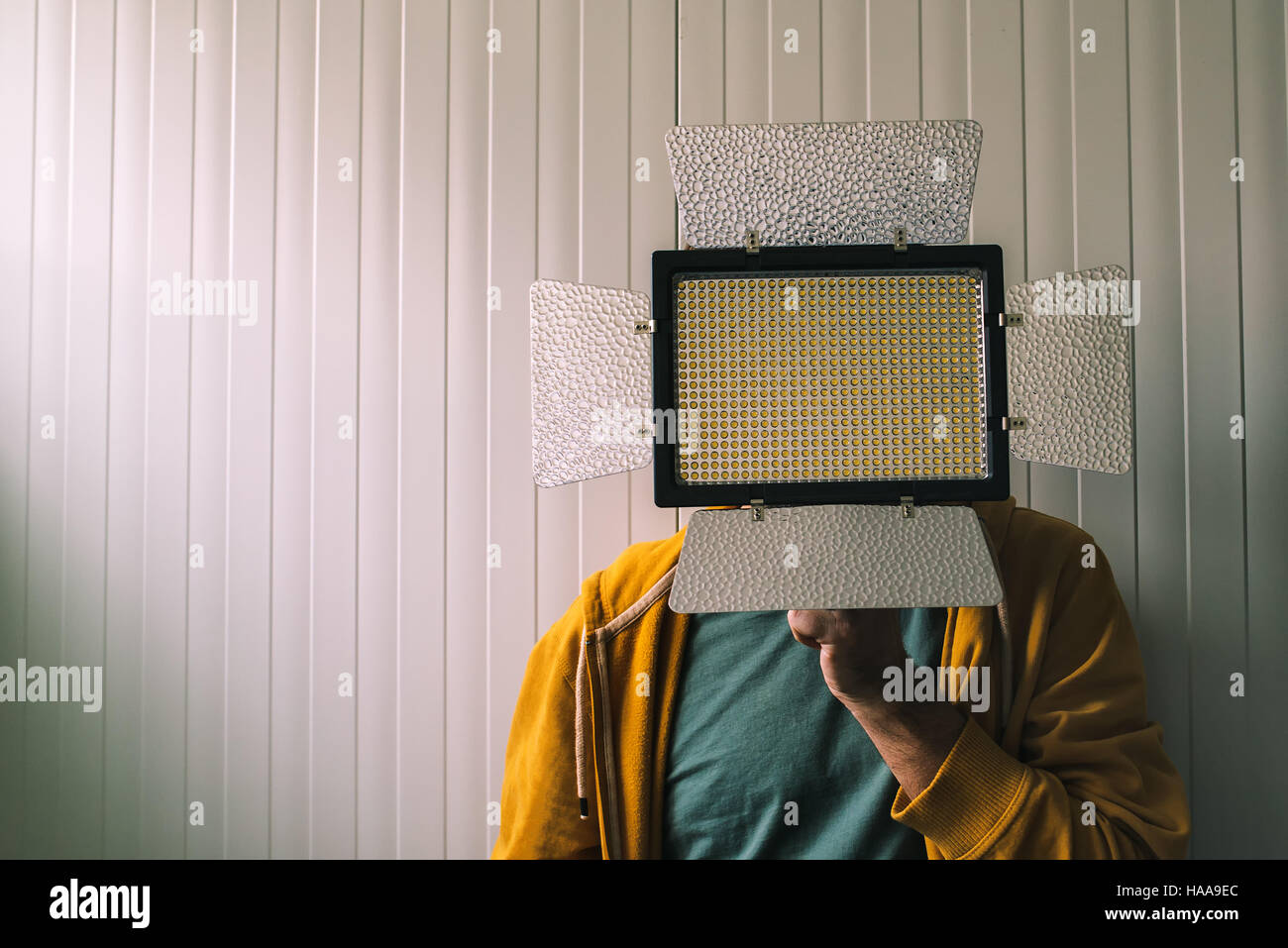 Man posing with led lighting equipment covering his face Stock Photo ...