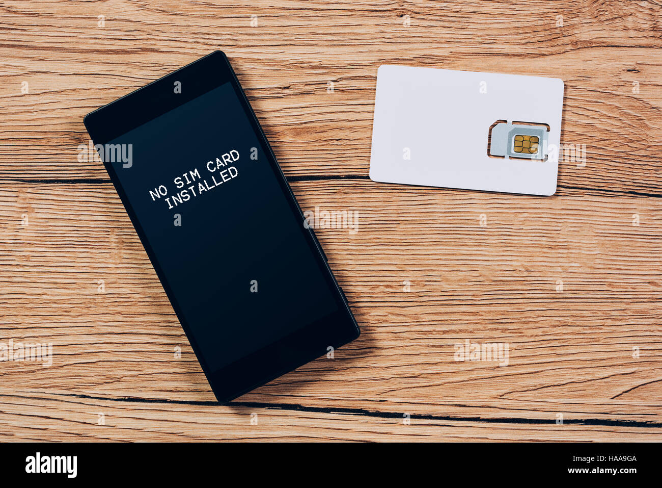 No SIM card installed notification on smartphone screen, top view mock ...